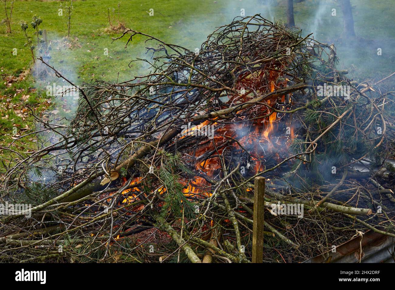 Bonfire clearing up after storm damage rubbish Stock Photo - Alamy