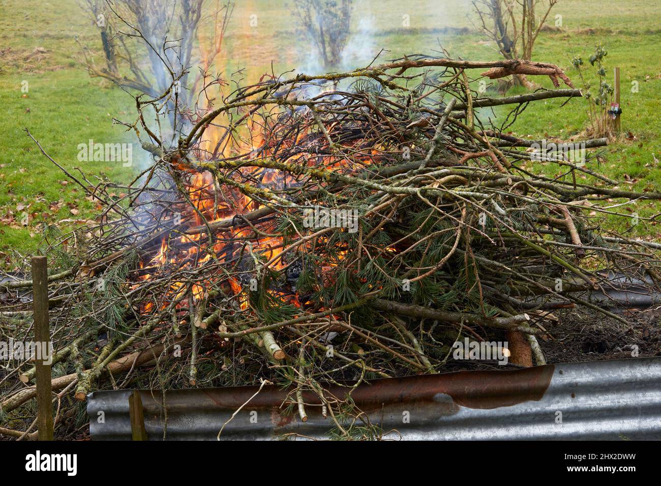 Bonfire clearing up after storm damage rubbish Stock Photo - Alamy