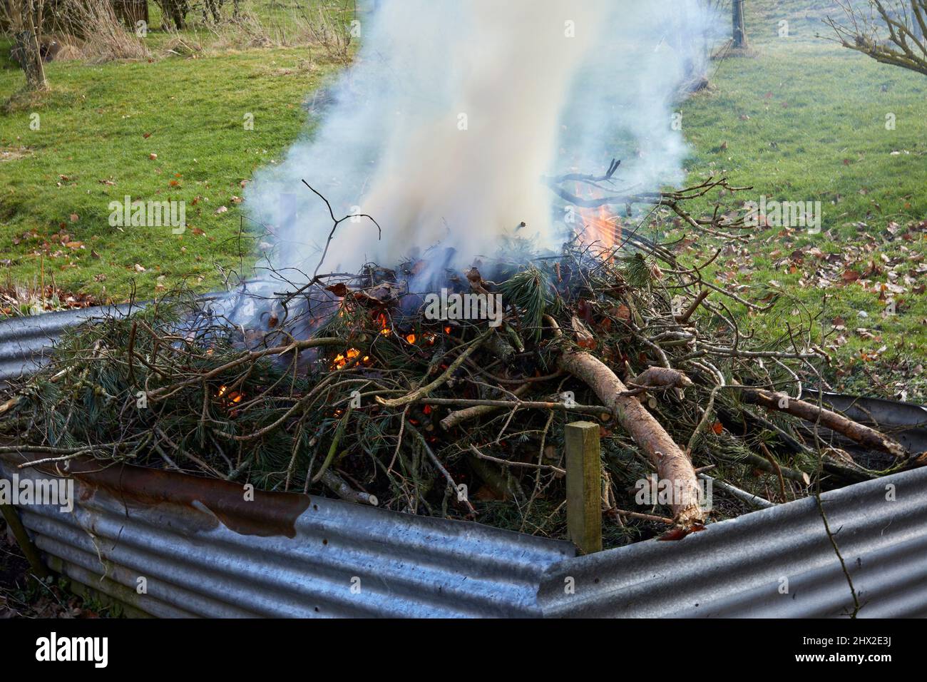 Bonfire clearing up after storm damage rubbish Stock Photo - Alamy