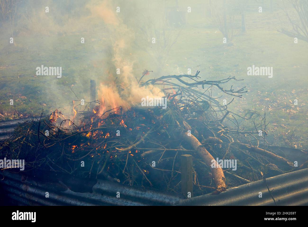 Bonfire clearing up after storm damage rubbish Stock Photo - Alamy