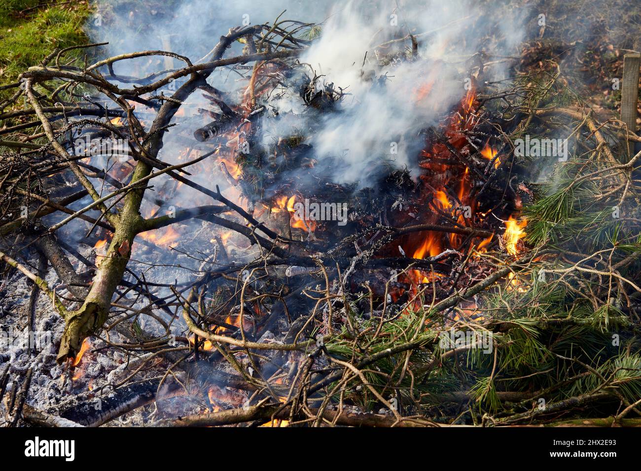Bonfire clearing up after storm damage rubbish Stock Photo - Alamy