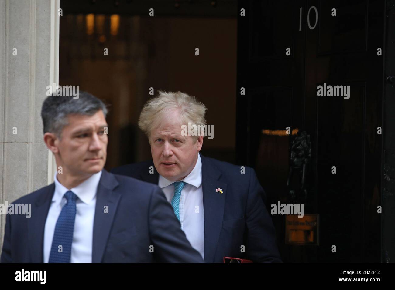 Prime Minister Boris Johnson (right) leaves 10 Downing Street, London ...