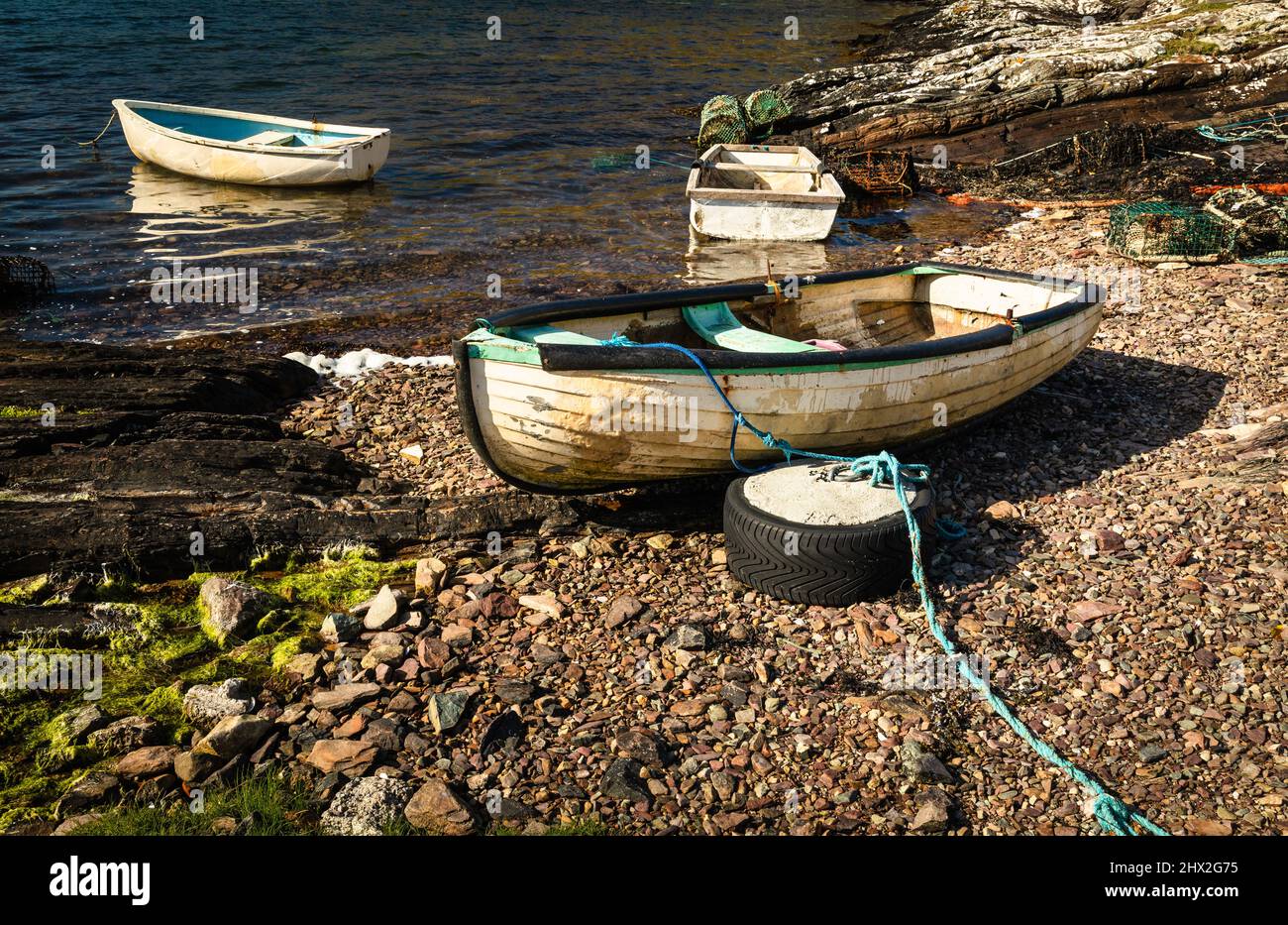Small boats moored at the head of Killary Bay Little, Connemara, County ...