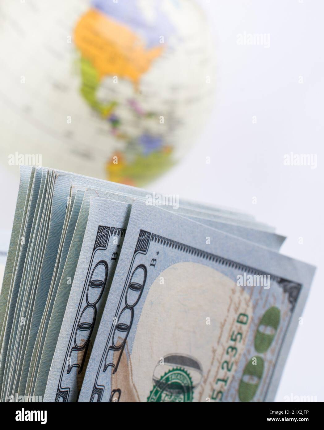 World globe banknotes hi-res stock photography and images - Alamy