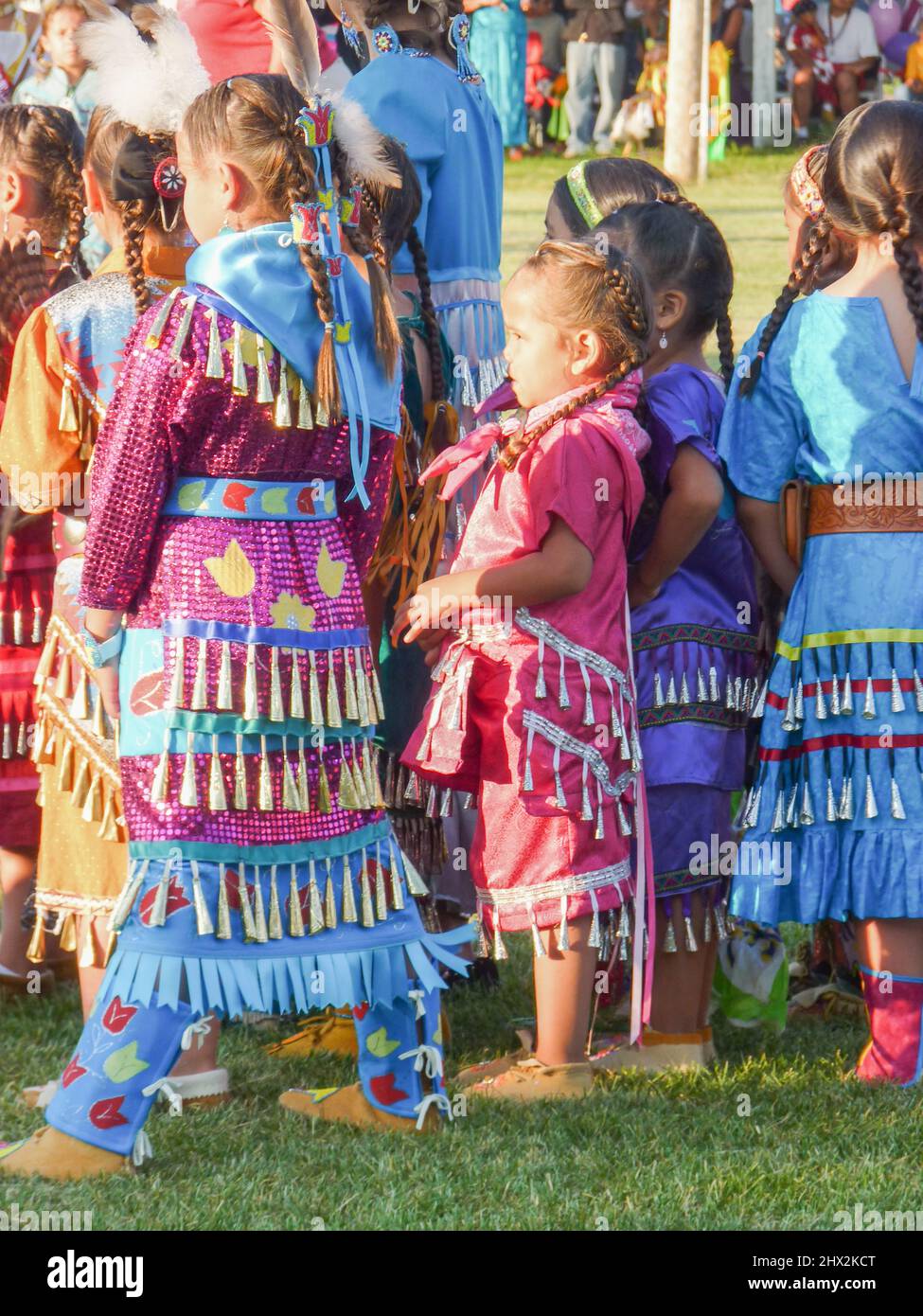 Young Native American dances taking part in pow wow festival in costume ...