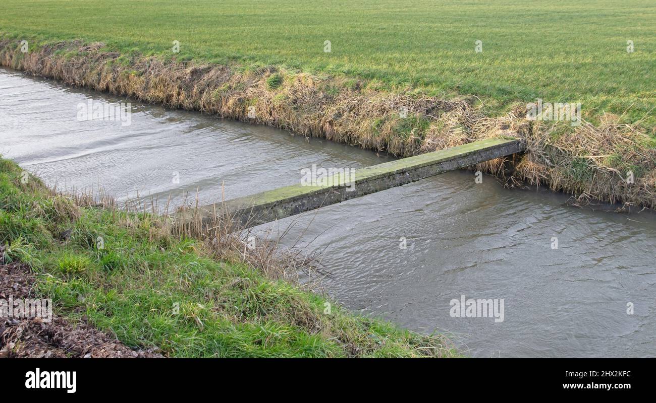 Small concrete hiking bridge over a small ditch, the Netherlands Stock ...