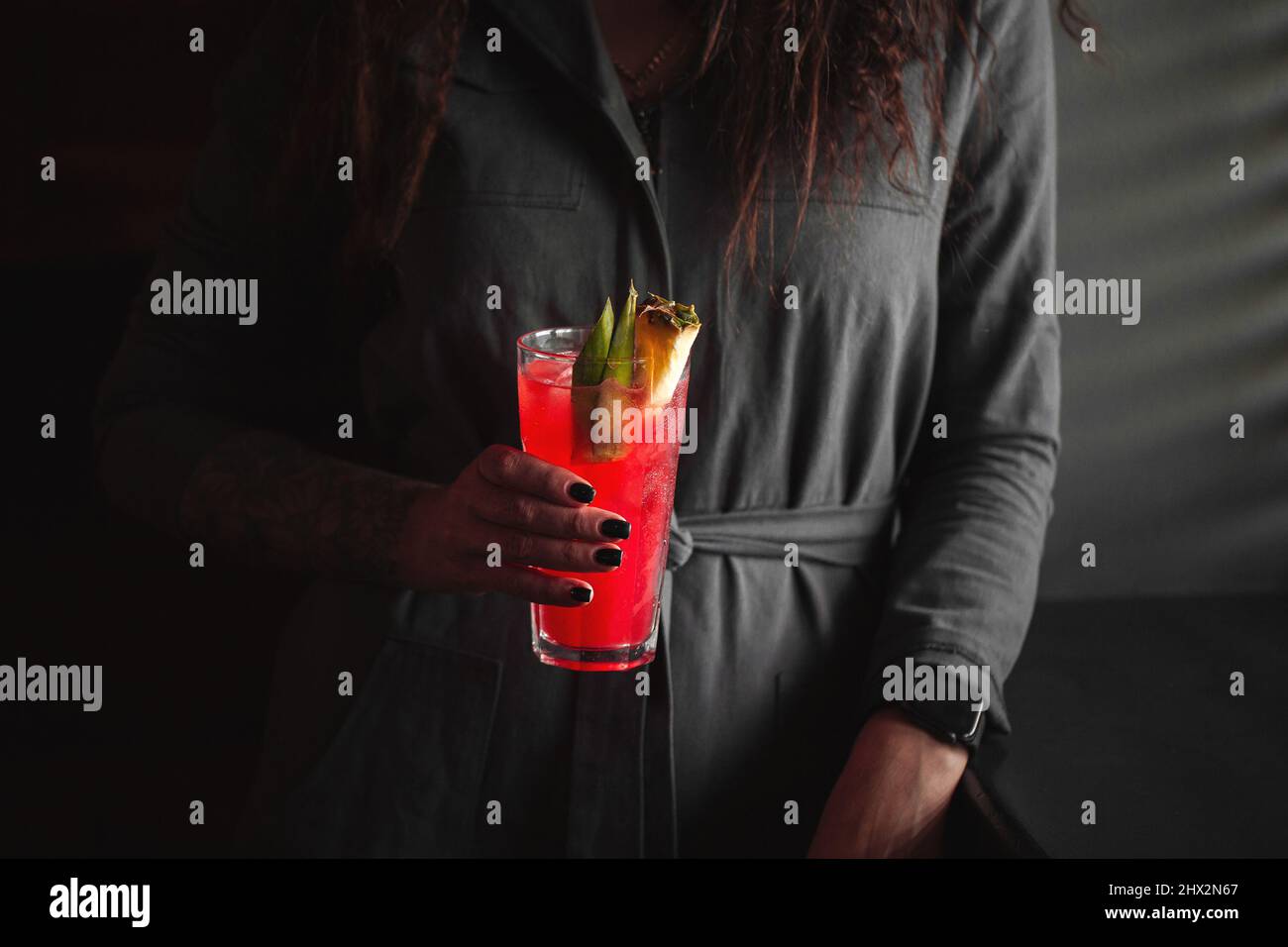 Woman holding liquor in hi-res stock photography and images - Alamy