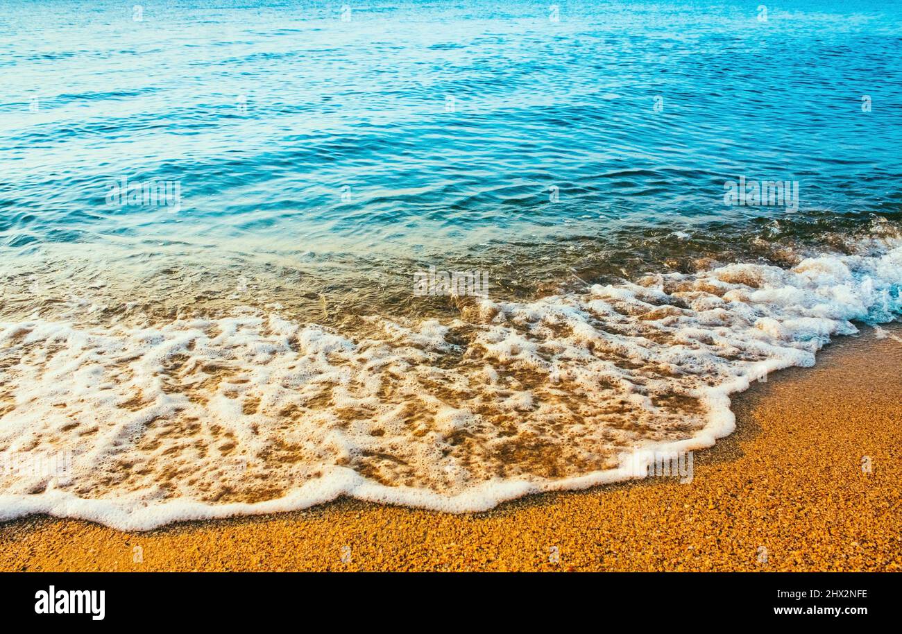 Waves washing up beach over hi-res stock photography and images - Alamy