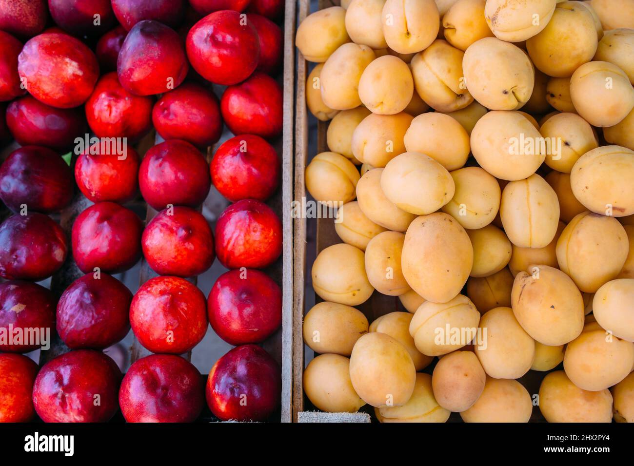 Fresh ripe fruits on the market in boxes Stock Photo - Alamy