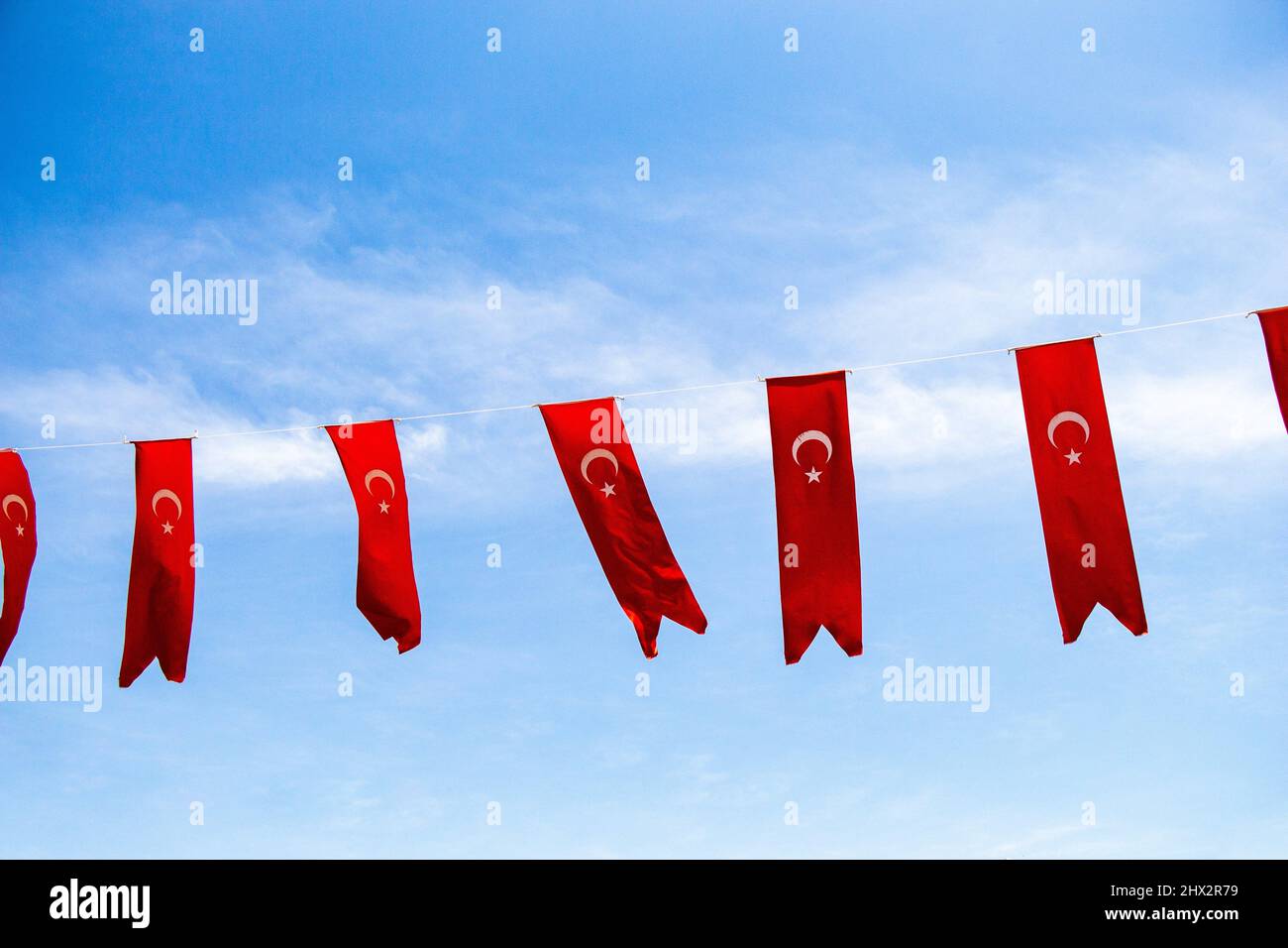 Turkish national flags with white star and moon in sky Stock Photo - Alamy