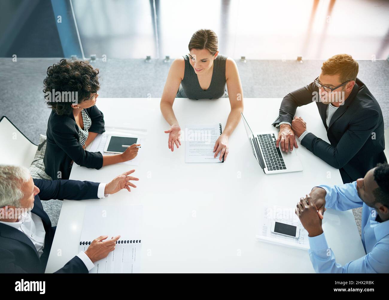 Theyre innovators. Shot of a group of businesspeople having a meeting ...