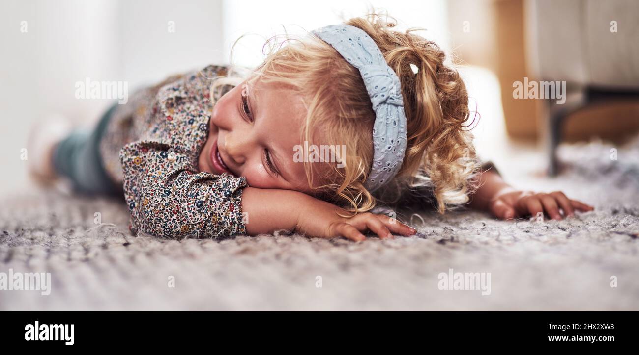 Im just going to lay here. Cropped shot of an adorable little girl ...