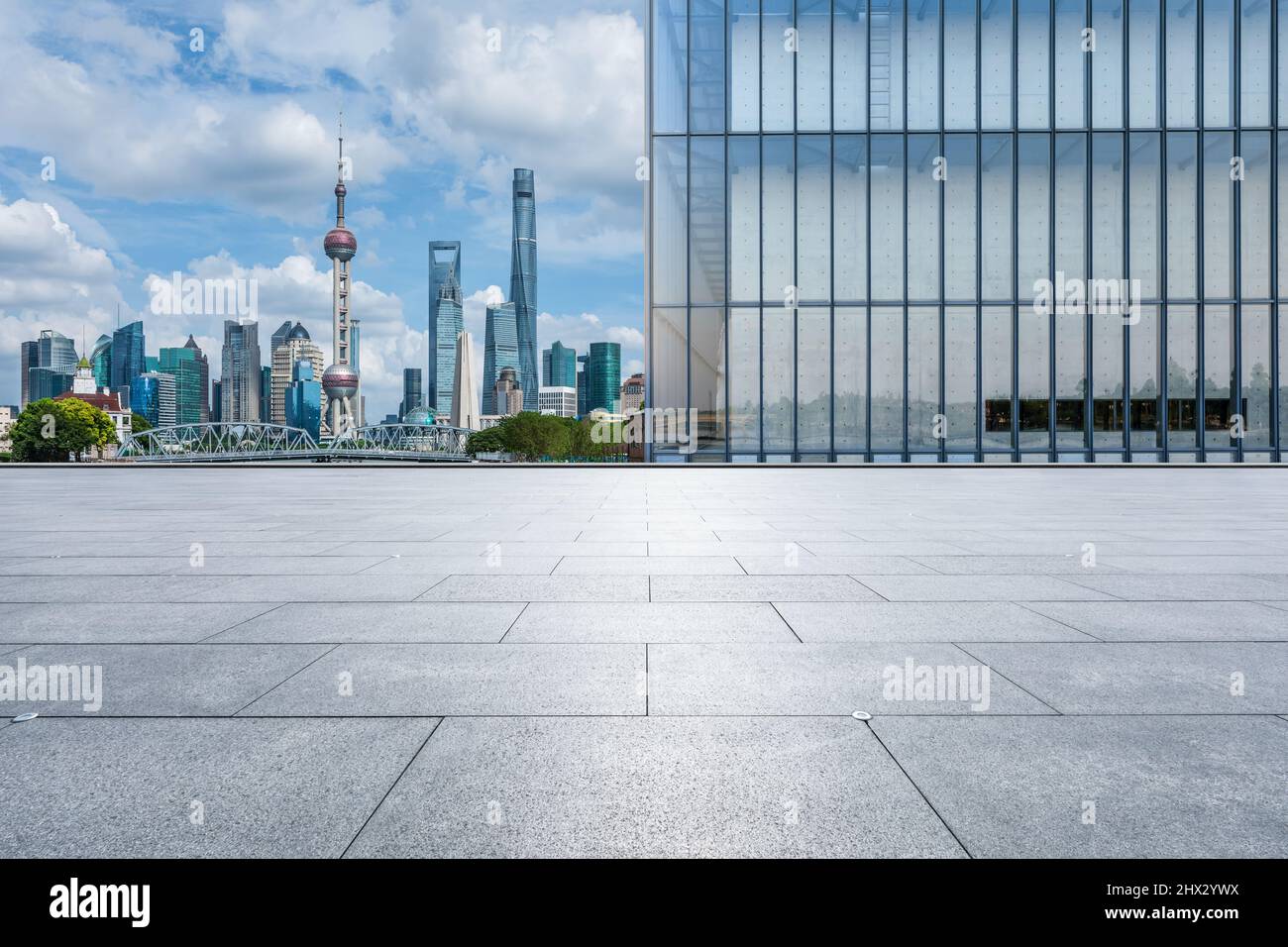 Panoramic skyline and modern commercial buildings with empty square ...