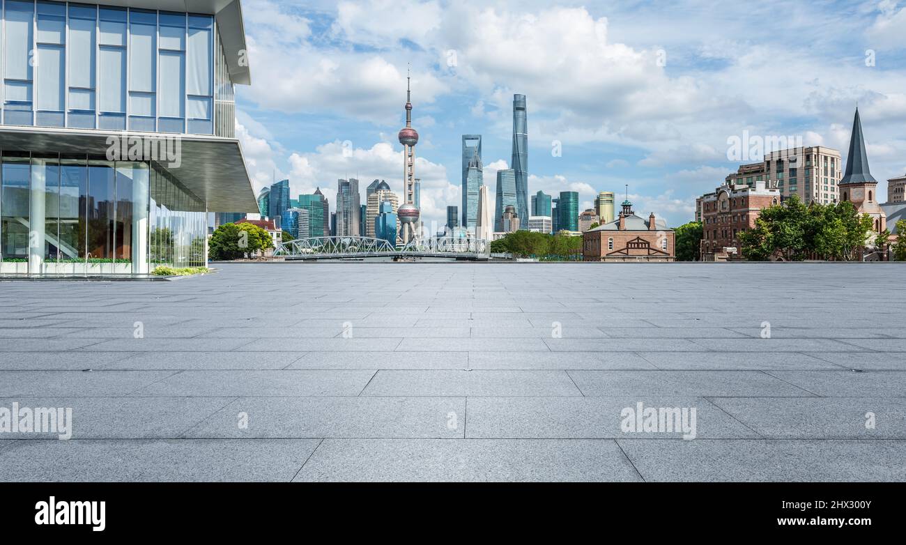 Panoramic skyline and modern commercial buildings with empty square ...