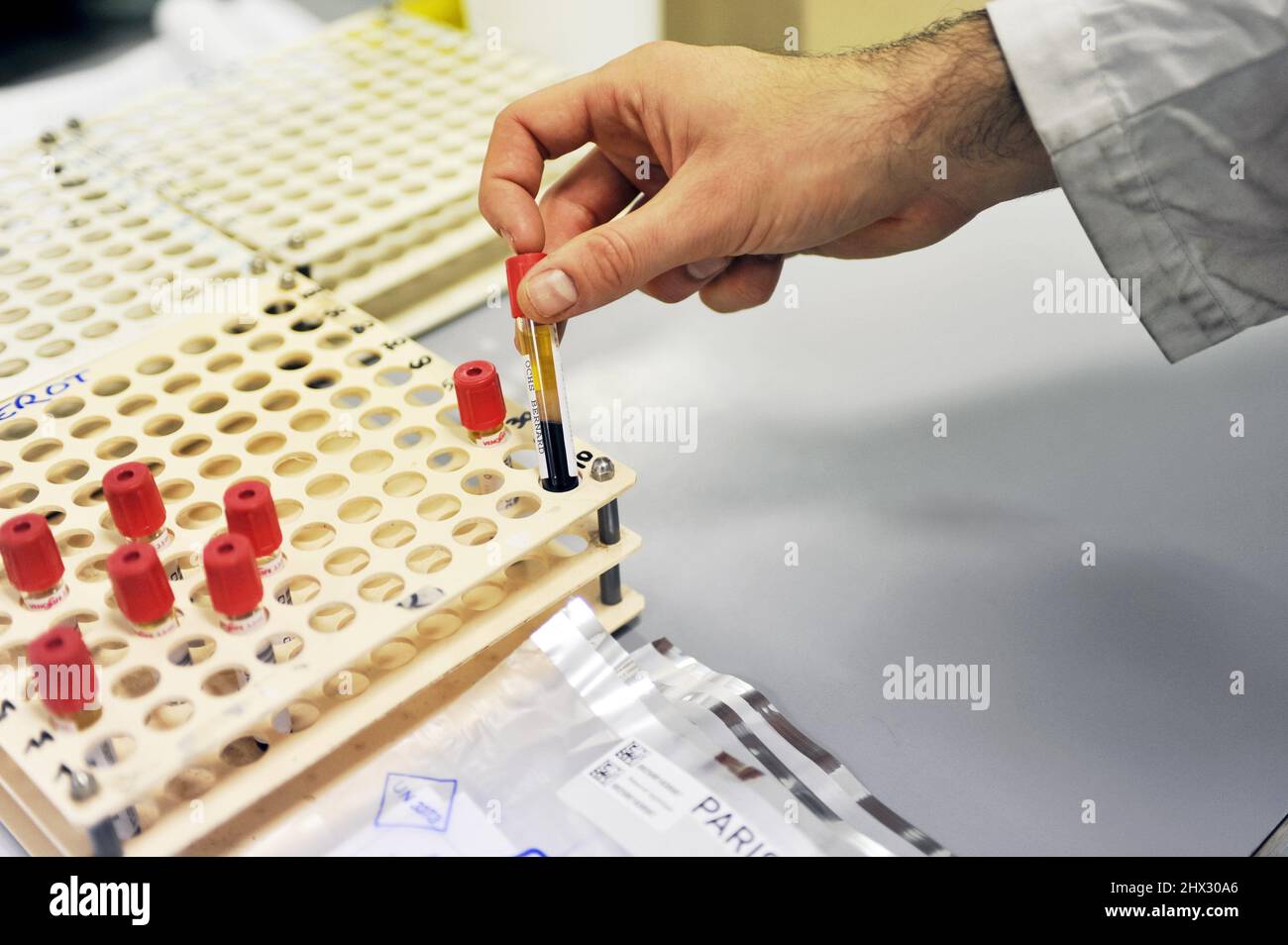 FRANCE - PARIS - LABORATORY A laboratory technician handles a variable ...
