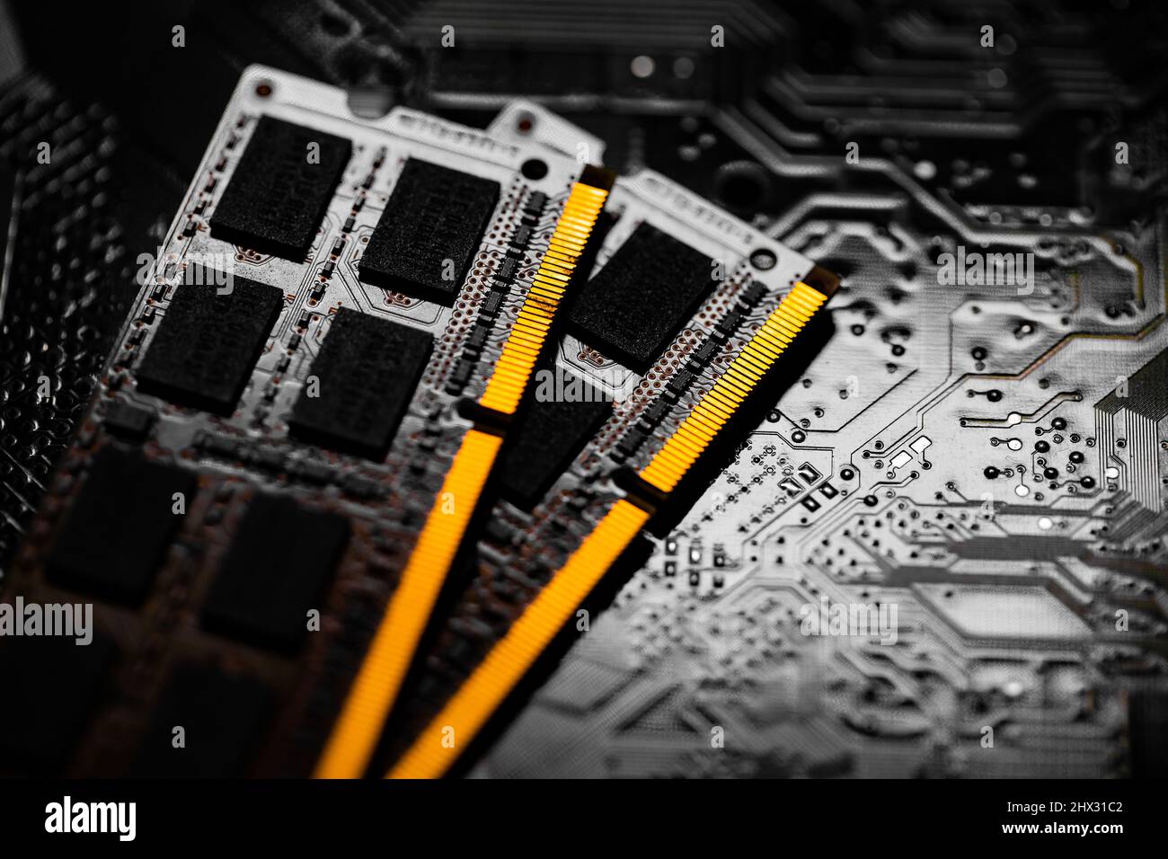 Macro Close up of computer RAM chip and motherboard on dark background ...