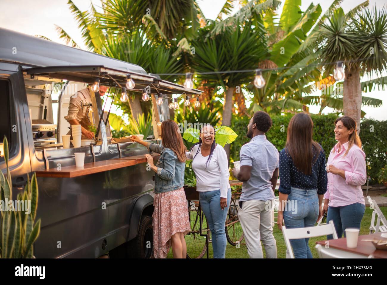 Queue of diverse people to food truck Stock Photo - Alamy