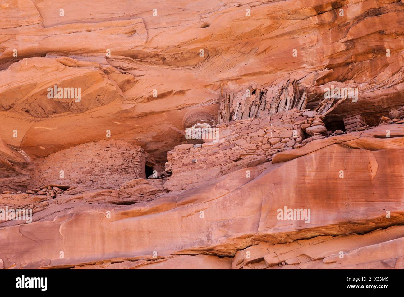 An Ancestral Puebloan Native American cliff dwelling ruin on a ledge in ...