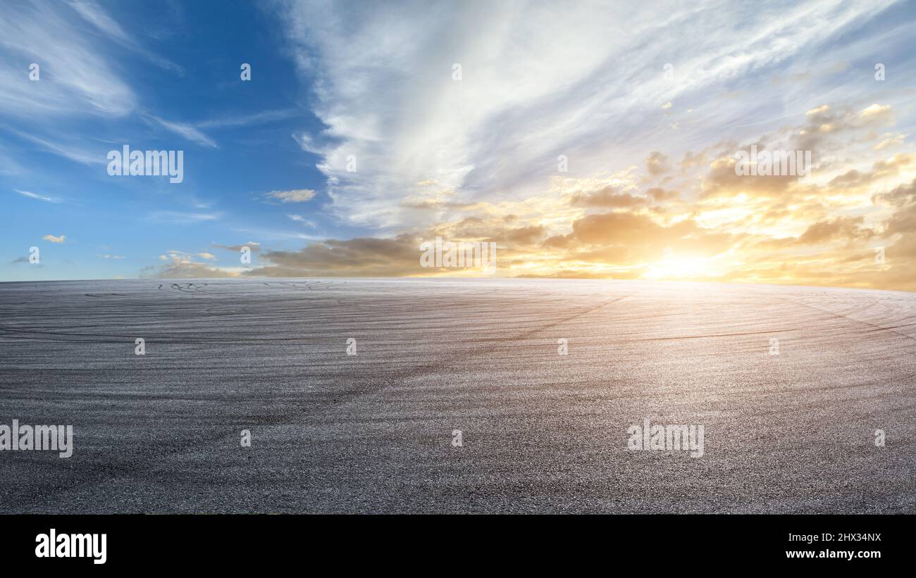 Empty asphalt road platform and beautiful sky cloud scenery at sunset ...