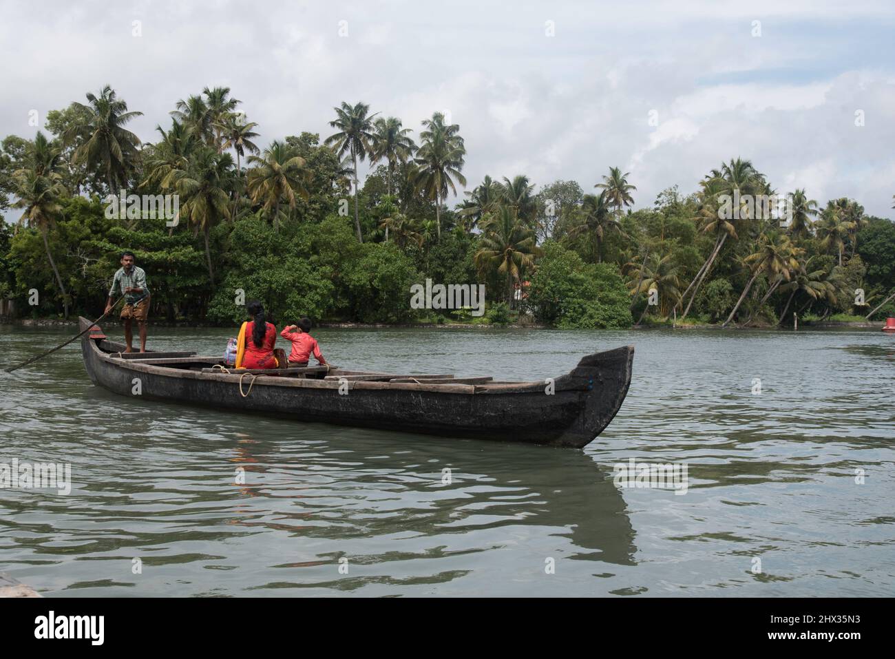 Primitive wooden transport boat in the Backwaters of Kerala, India ...