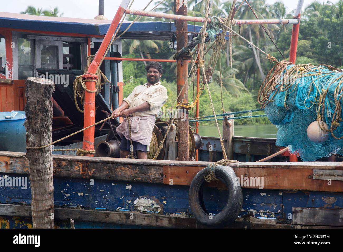 A traditional fishing boat in the Kerala backwaters, India Stock Photo ...