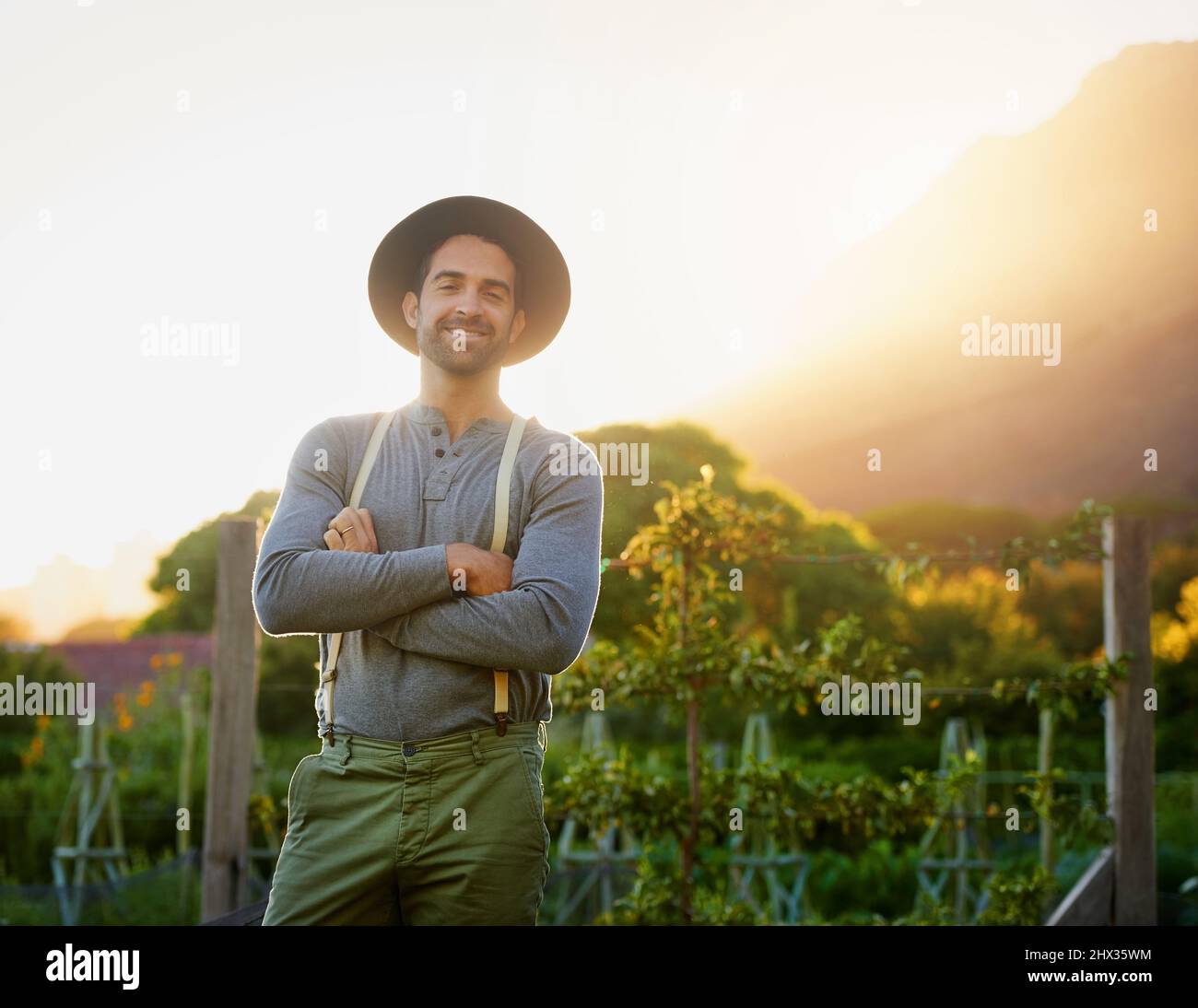 The leader in the field of farming. Portrait of a confident young man ...