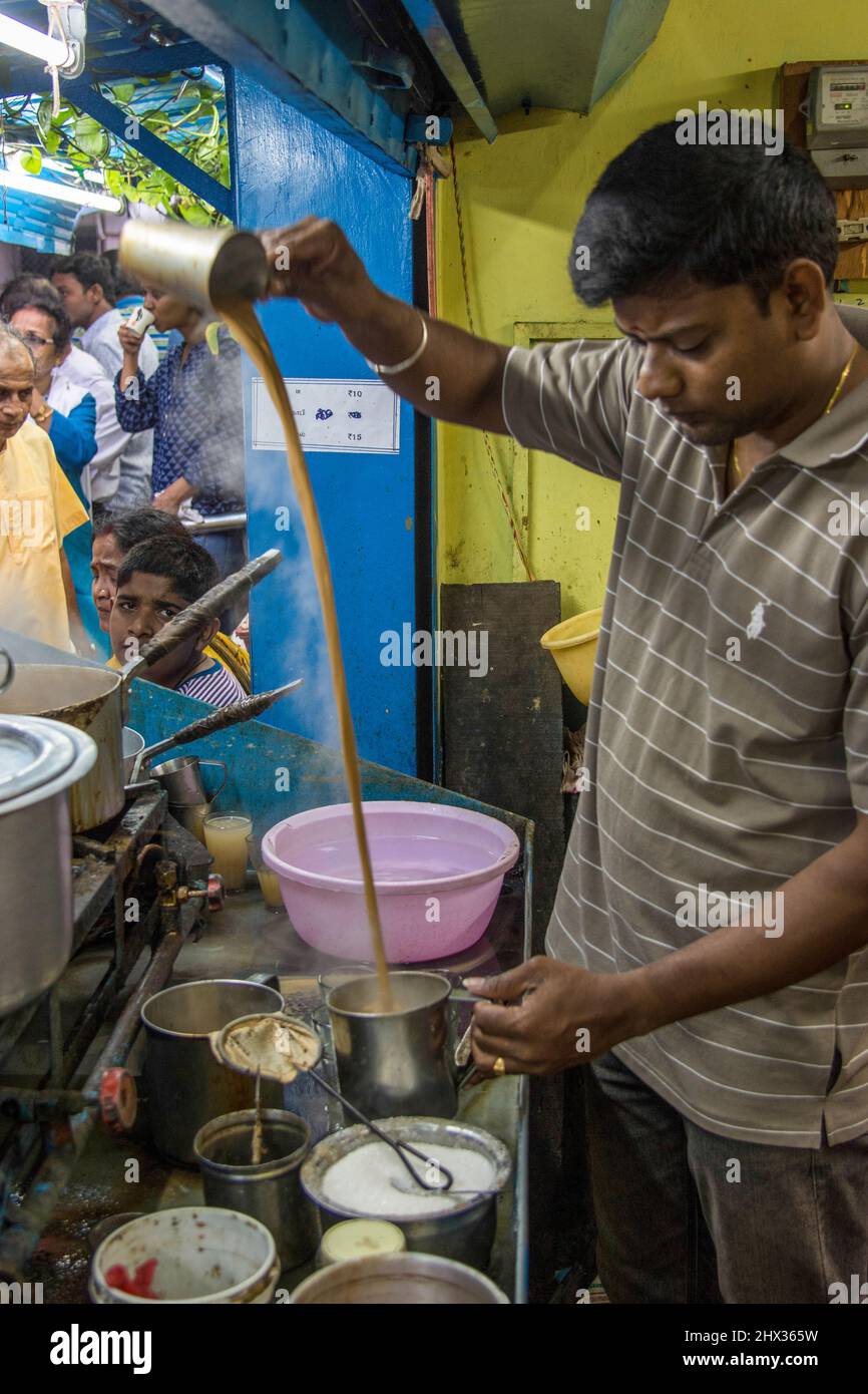 street vendor making chai Photographed in India Stock Photo - Alamy