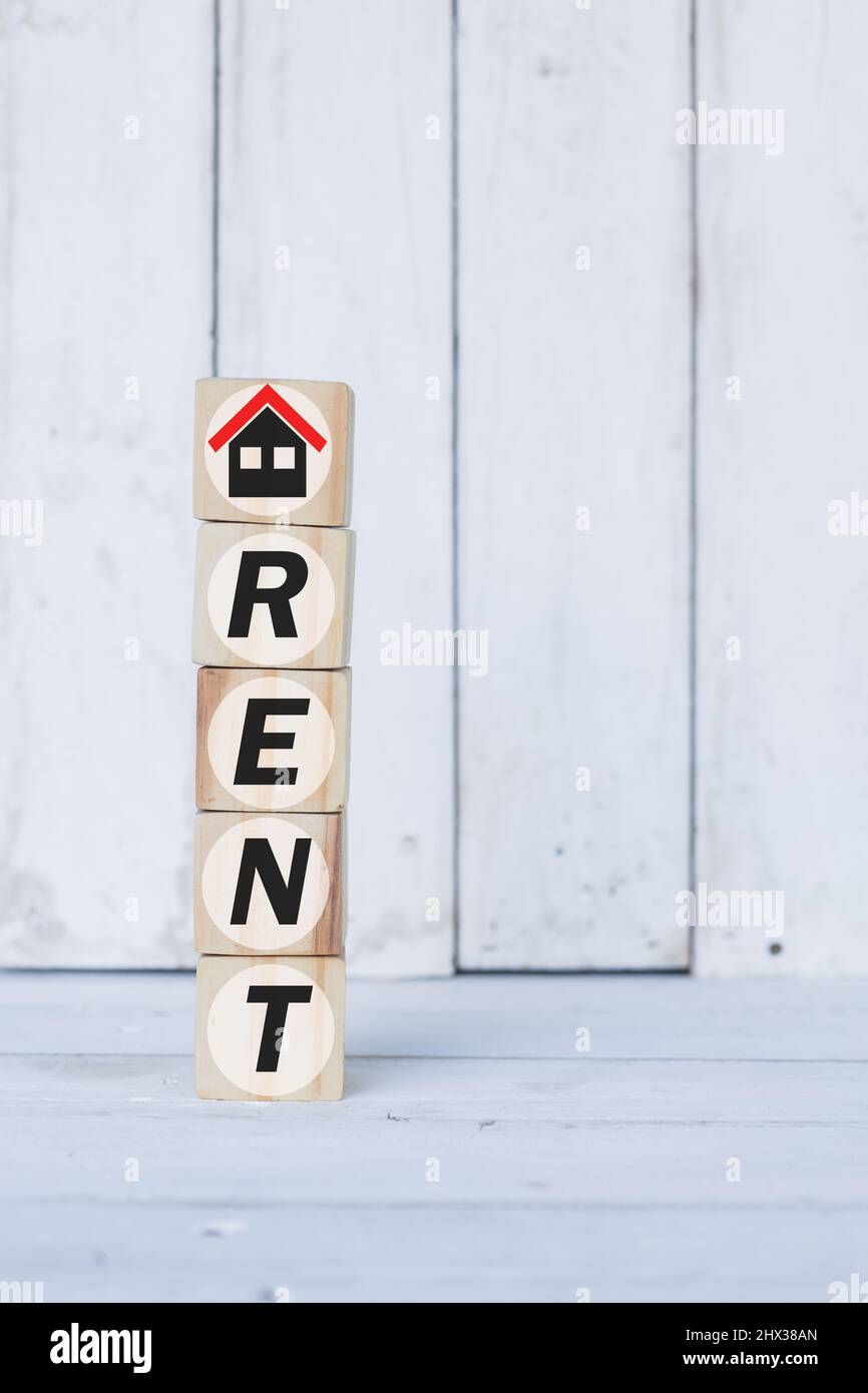 rent word or concept on wooden blocks, white wood background Stock ...