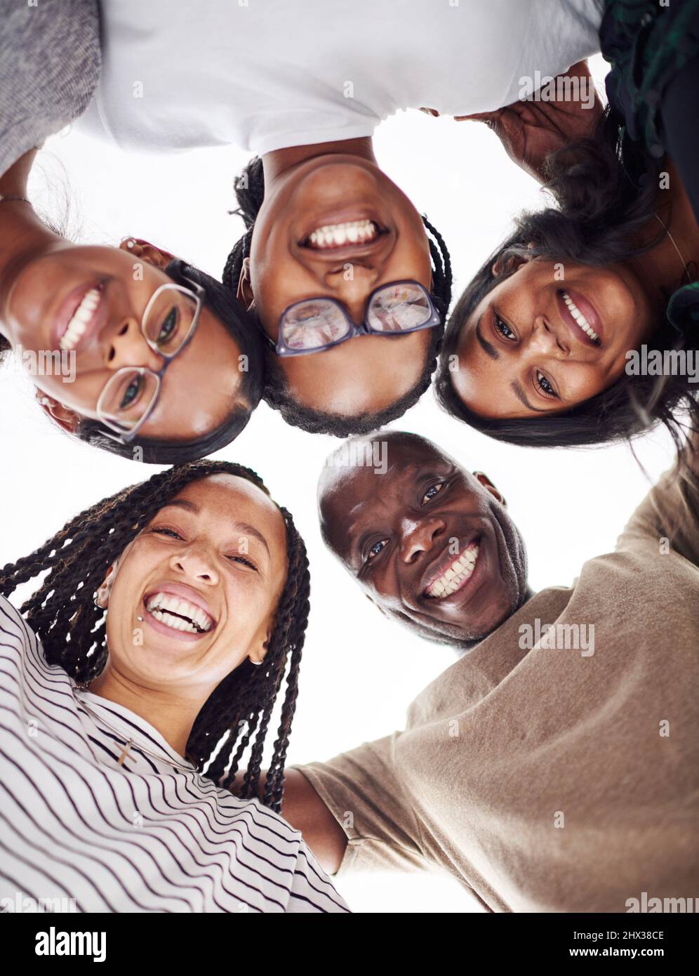 Make your circle bigger. Cropped shot of a group of people looking down ...