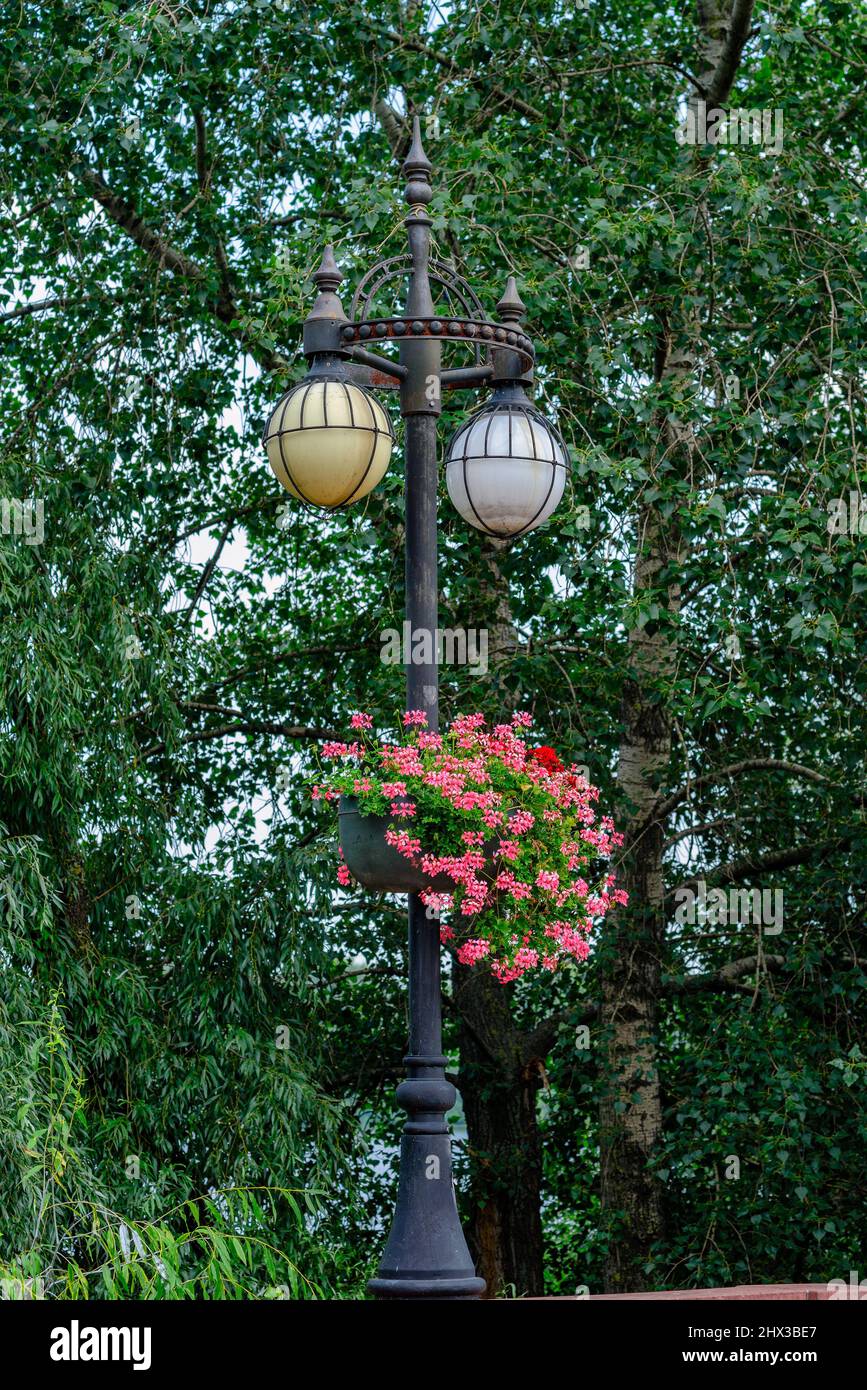 Street lamp with flowers Vases Stock Photo - Alamy