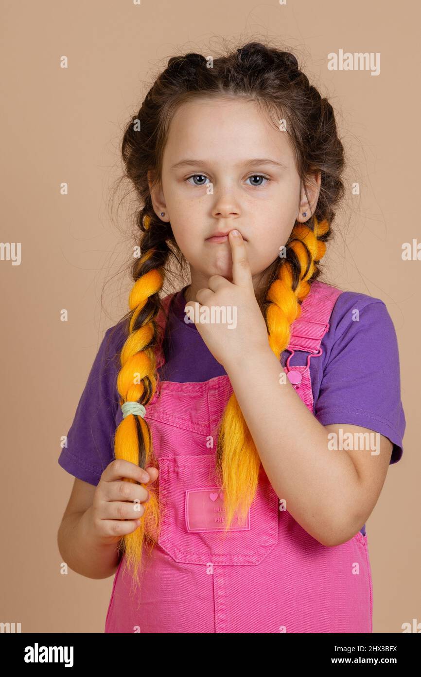 Child touching lips happy isolated hi-res stock photography and images ...