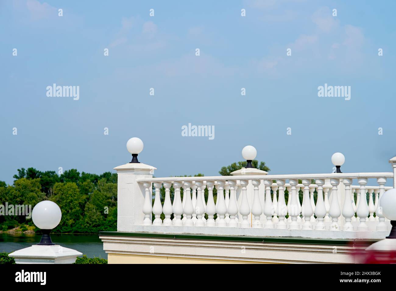 Terrace with white columns and round lanterns Stock Photo - Alamy