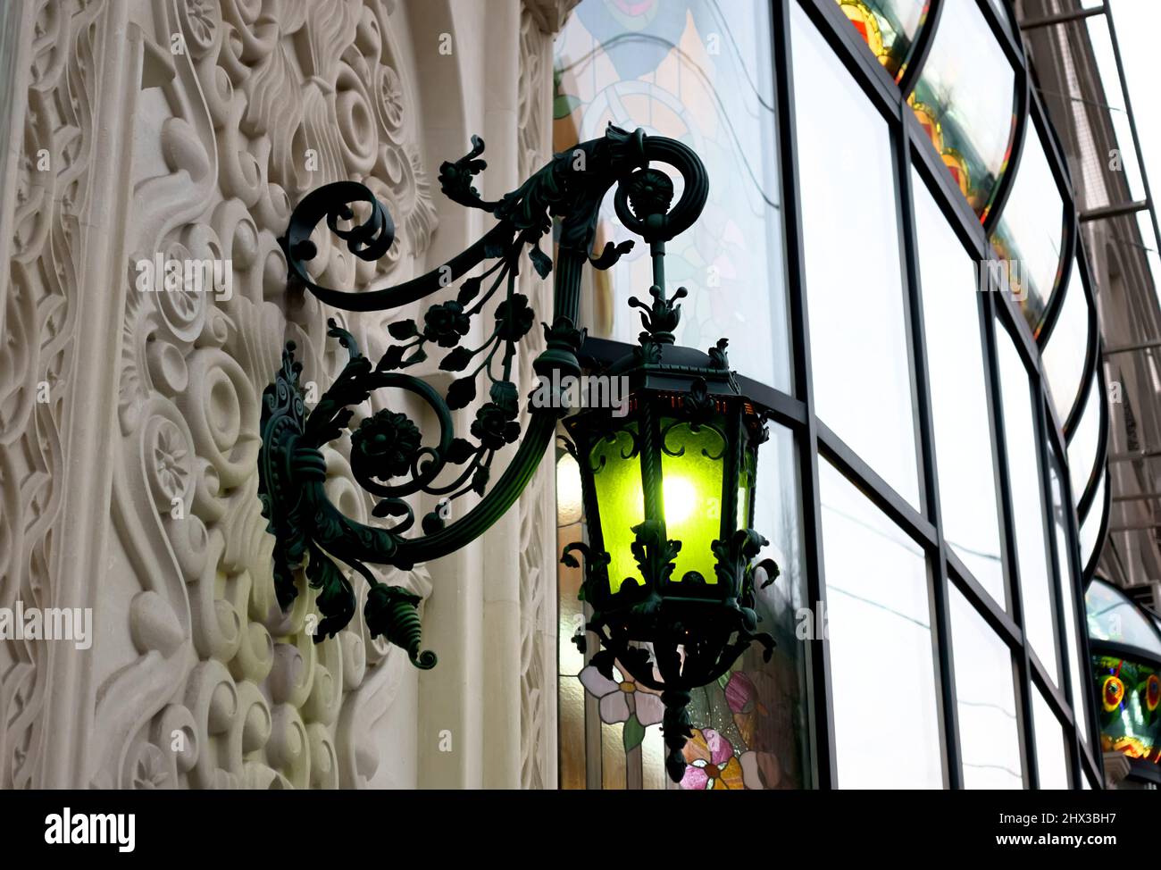 Decorative street lamp with green light Stock Photo - Alamy