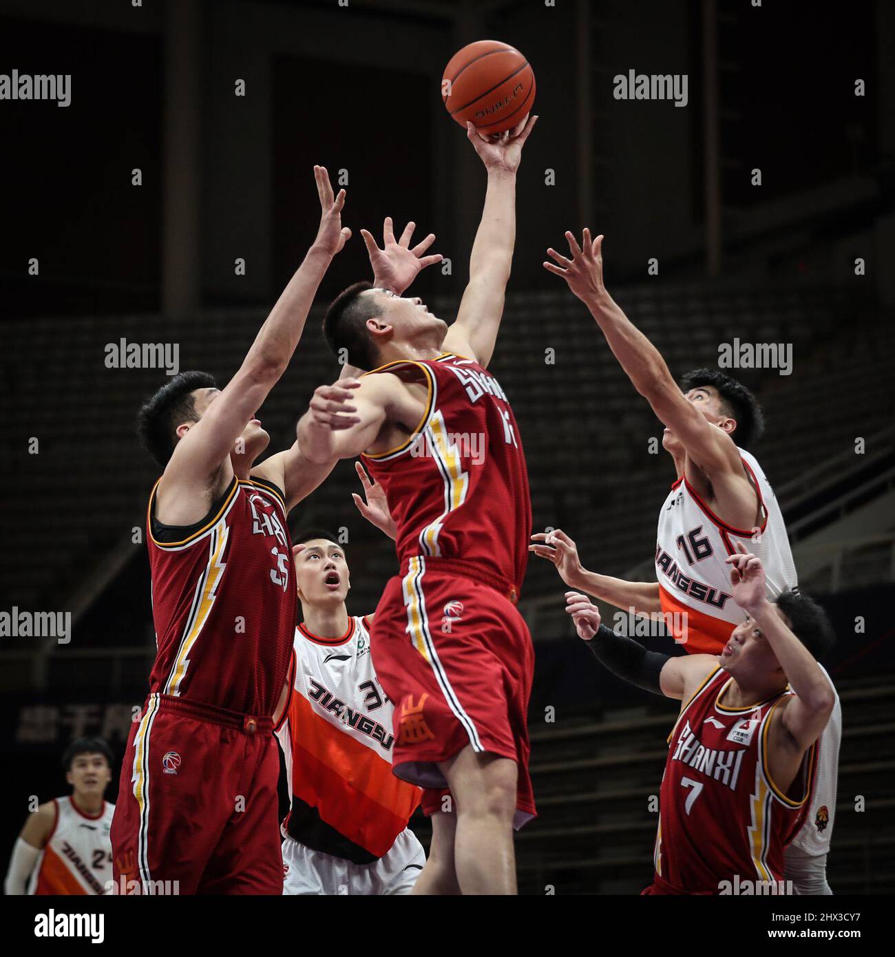 Shenyang. 9th Mar, 2022. Xing Zhiqiang (3rd R) of Shanxi Loongs vies ...