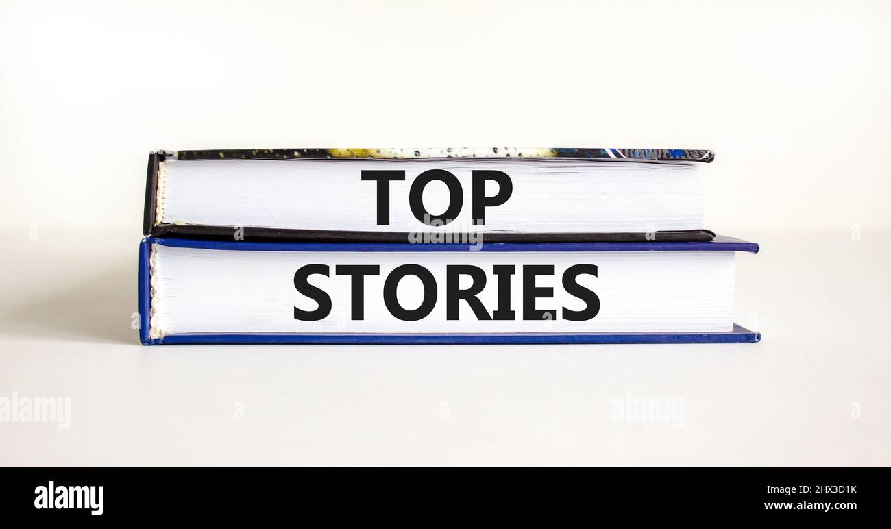 Top stories symbol. Concept words Top stories on books on a beautiful ...
