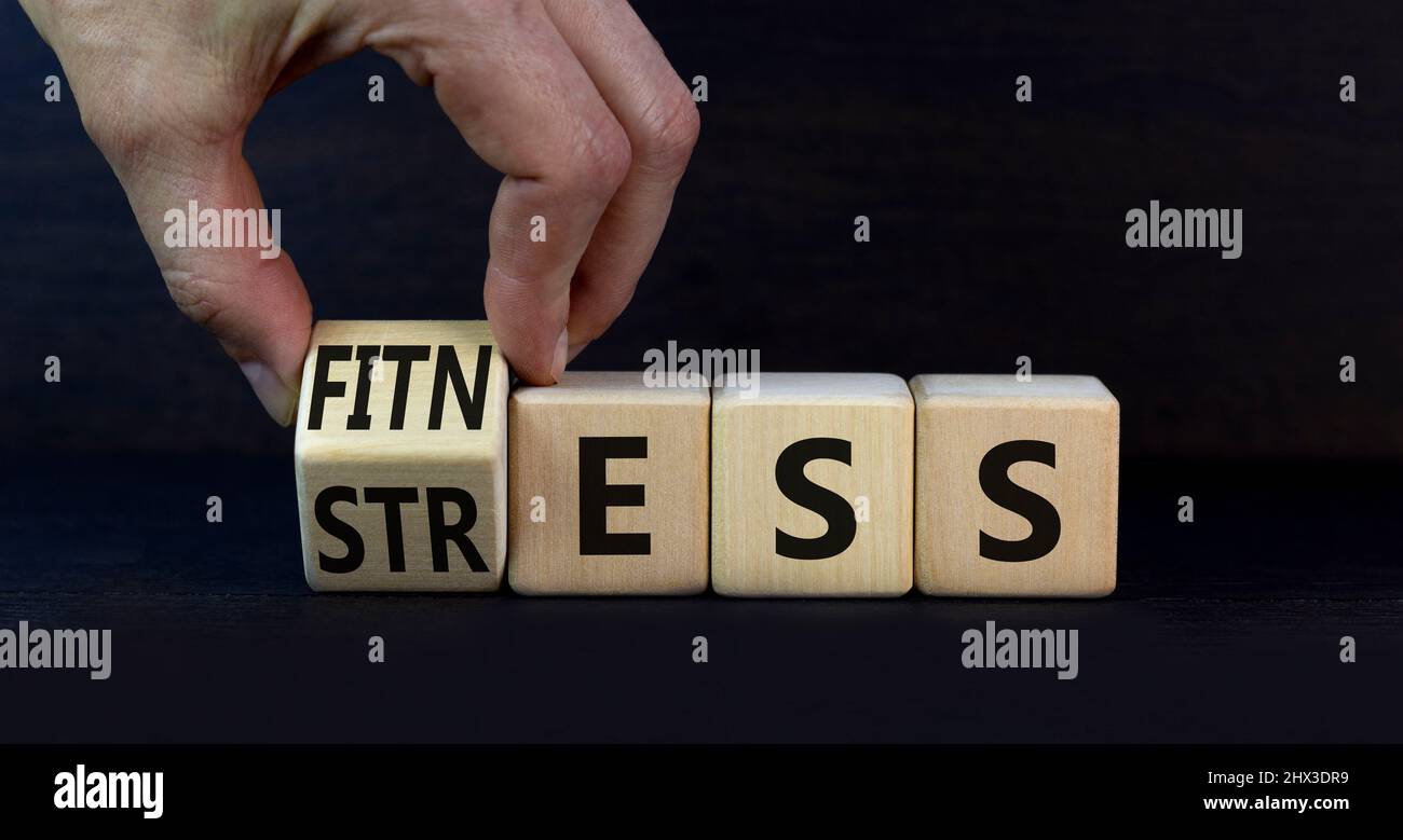 Fitness or stress symbol. Doctor turns the wooden cube and changes the ...