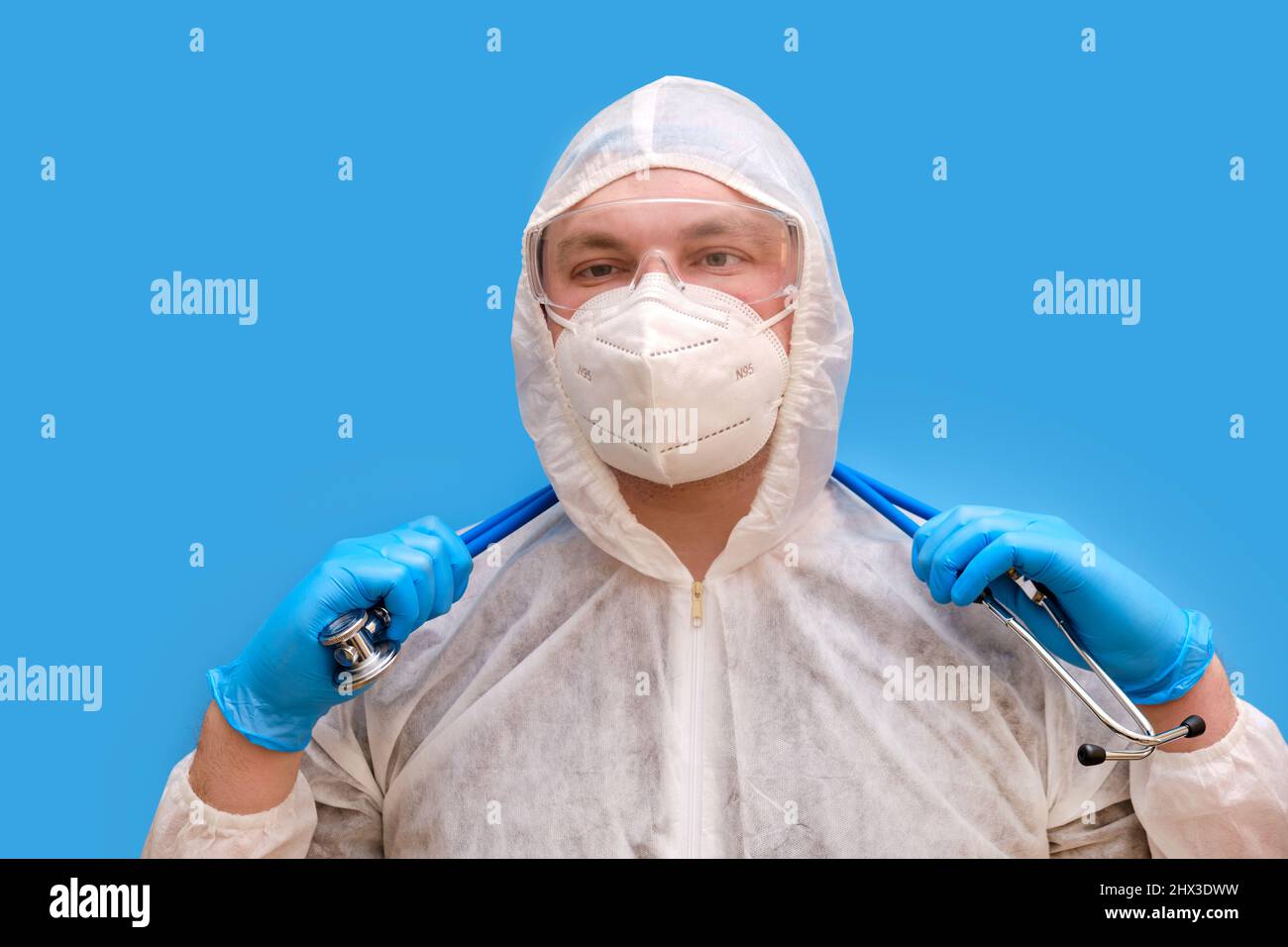 Man doctor medic in a protective suit uniform with goggles and face ...