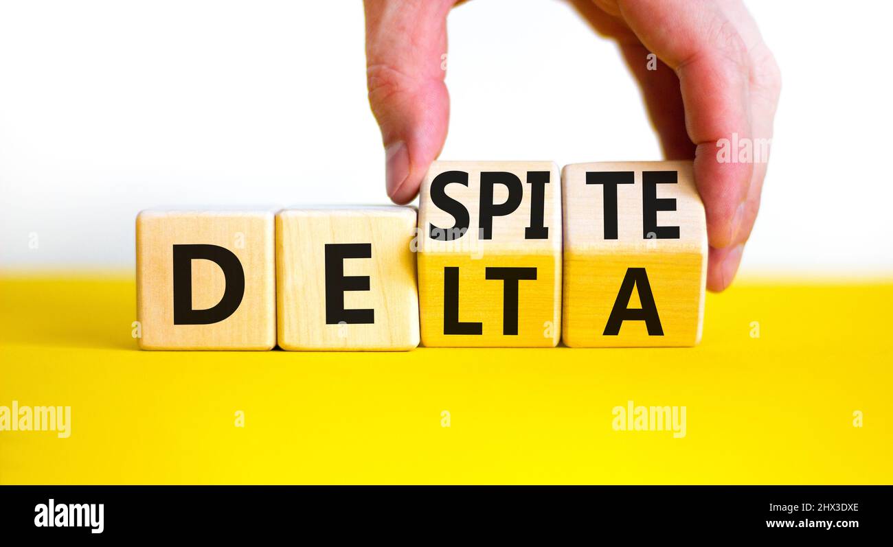 Covid-19 delta variant strain despite symbol. Doctor turns wooden cubes ...