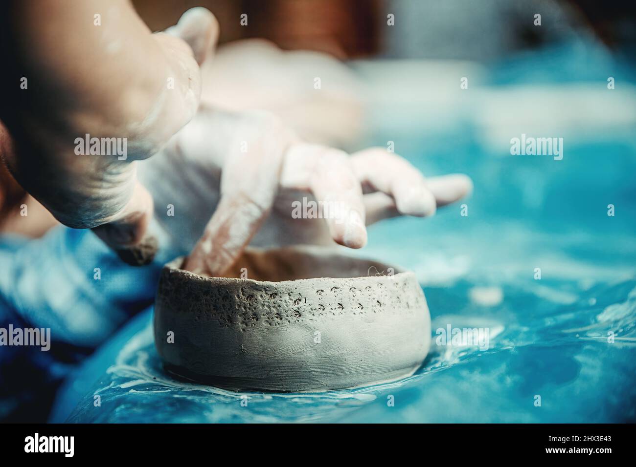 skilled hands of potter shaping the clay Stock Photo - Alamy