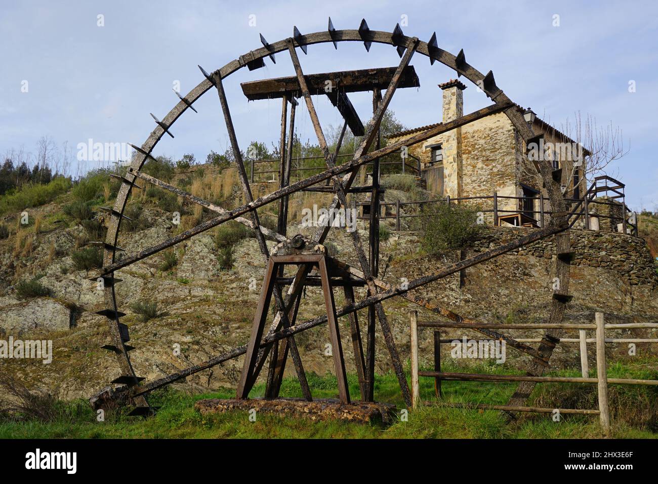 Landscape of water wheel on river Stock Photo - Alamy