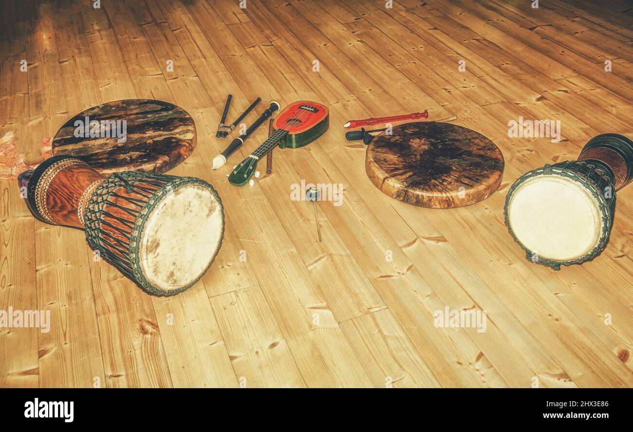 musical instruments on a wooden floor Stock Photo - Alamy