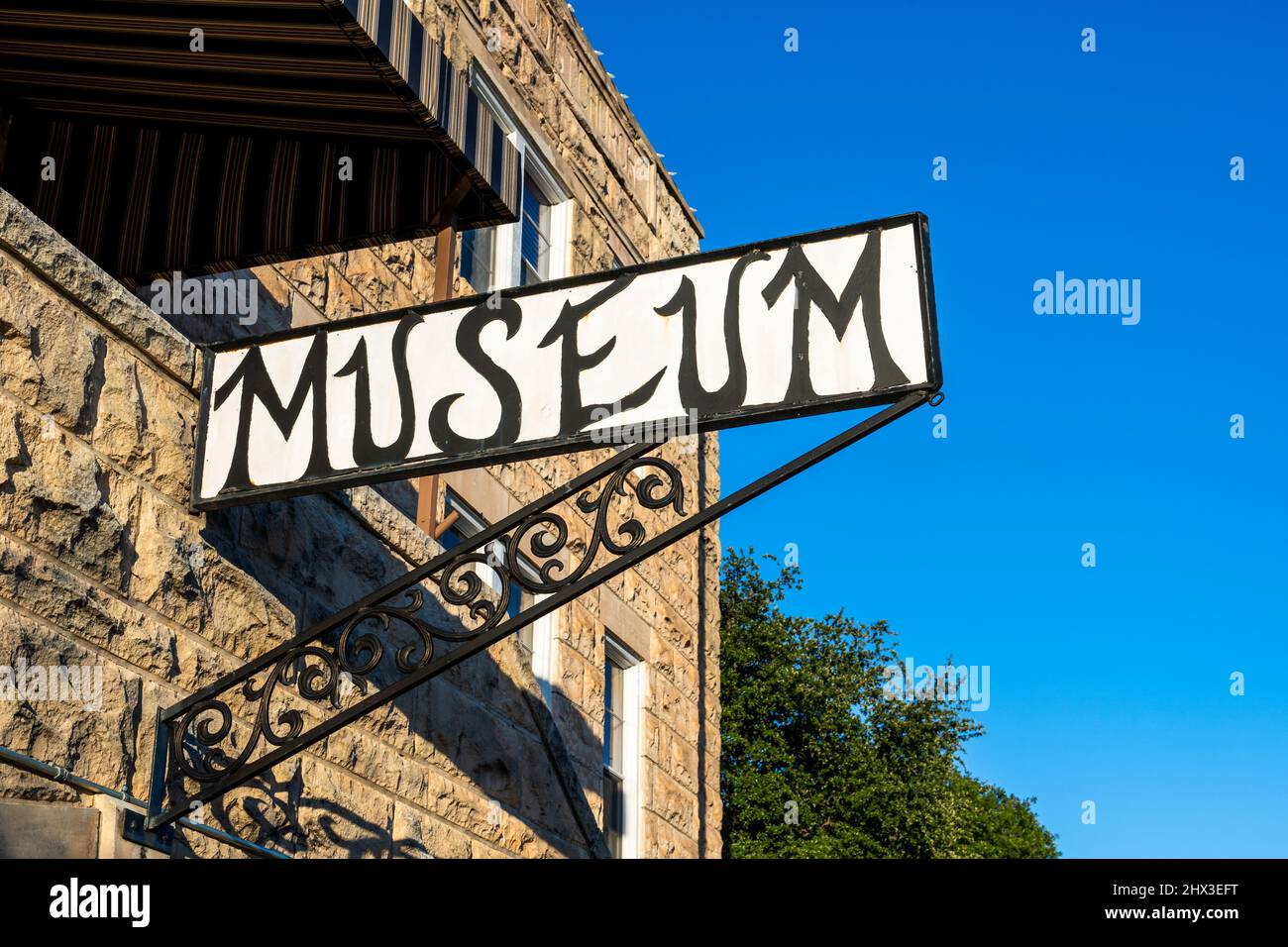 old style font word museum on a sign with black text on white ...