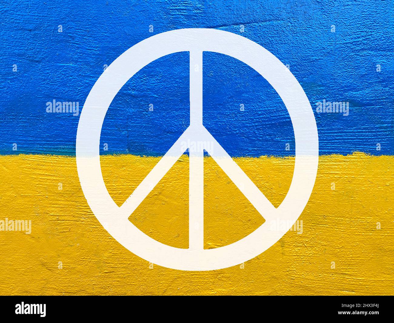 Stand with Ukraine: peace symbol on Ukrainian flag painted on wall ...
