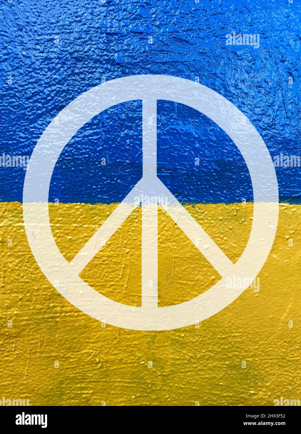 Stand with Ukraine: peace symbol on Ukrainian flag painted on wall ...