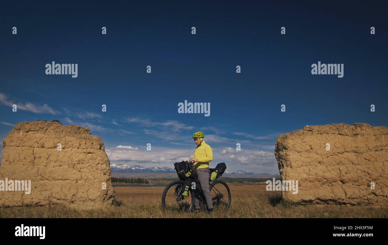 The man travel on mixed terrain cycle touring with bikepacking. The ...