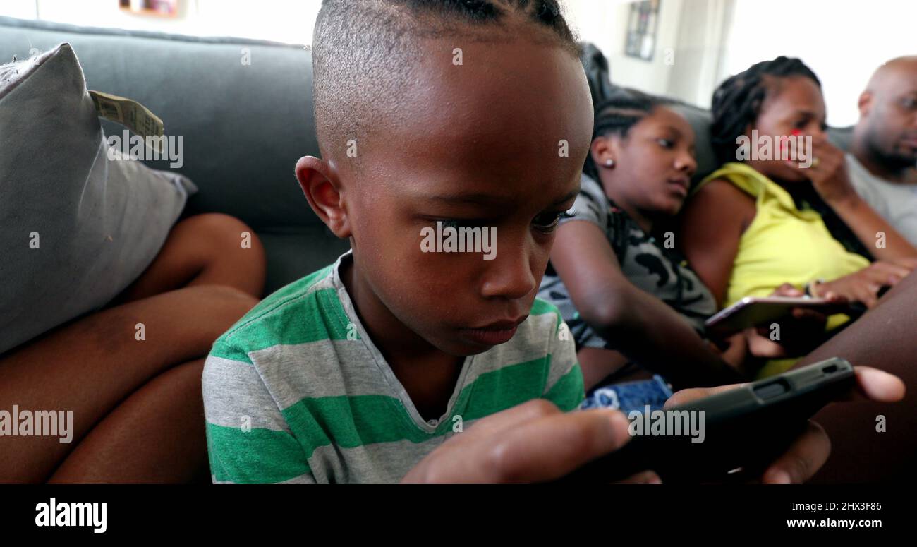 African family using technology devices at home, black parents and ...