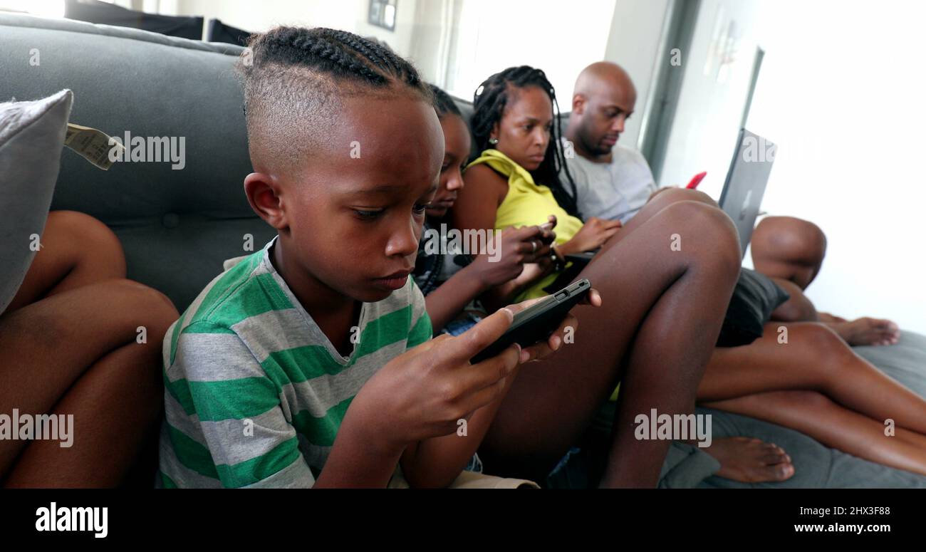 African family using technology devices at home, black parents and ...
