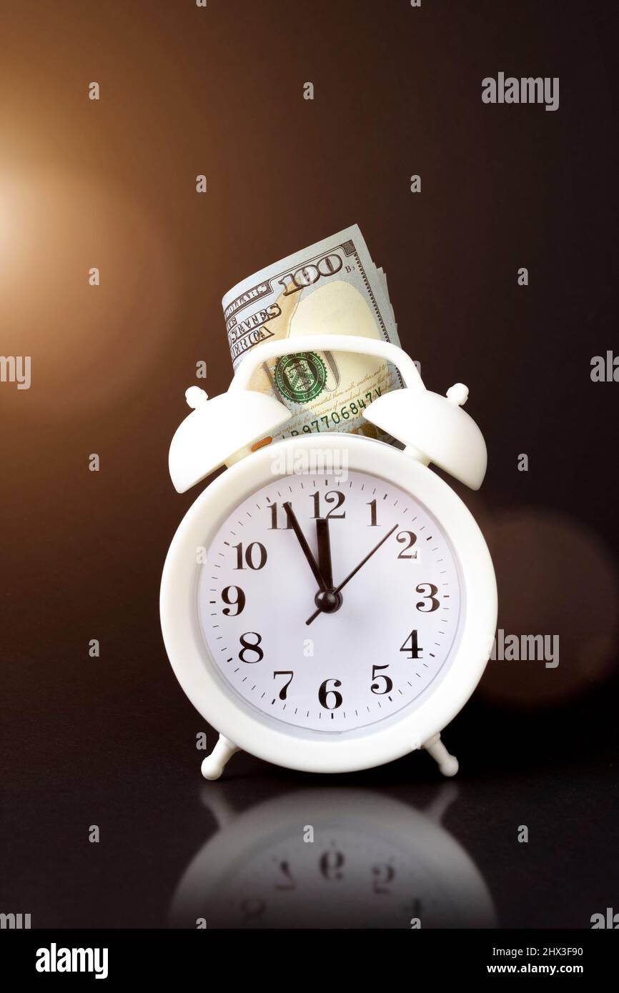 Finance and business. Finance concept with alarm clock and money ...