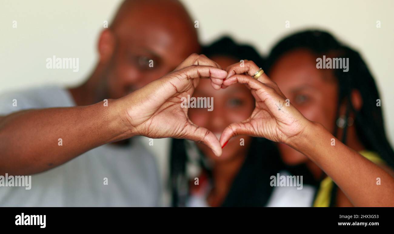 Black family making heart symbol with hands. African mixed race ...