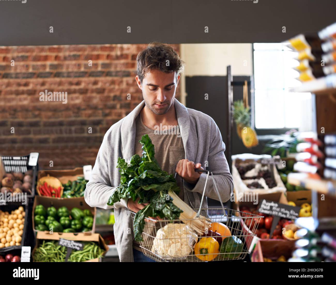 Man holding full shopping basket hi-res stock photography and images ...